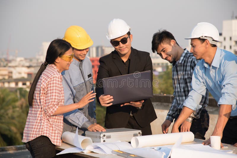 Group of Engineers and Architects Discuss at a Construction Site Stock ...