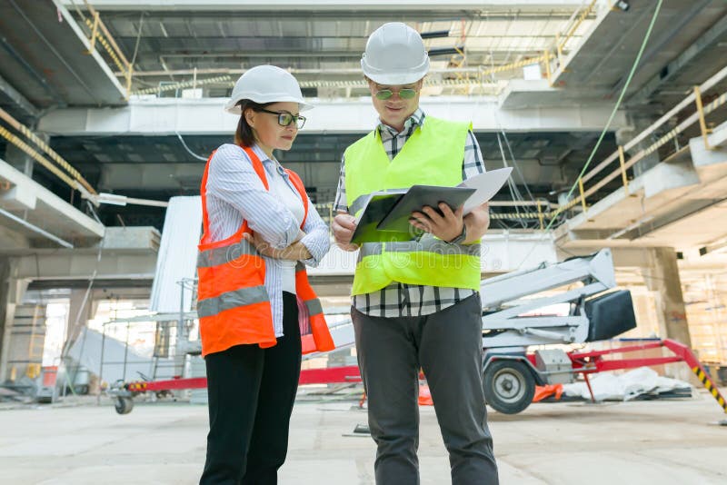 Group of Engineers, Builders, Architects on the Building Site ...