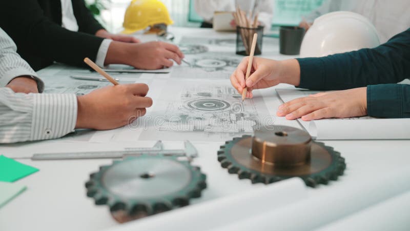 Collaborative Engineering Team Working on Technical Project with ...