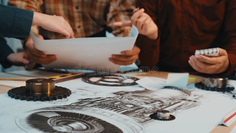 Engineers Collaborating on Turbine Design during Team Meeting with ...