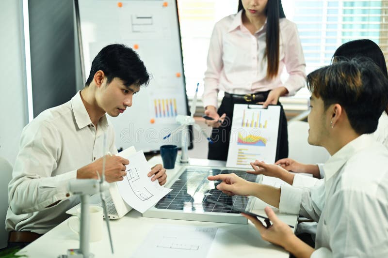 Group of Engineers Discussing a New Project during a Meeting in the ...