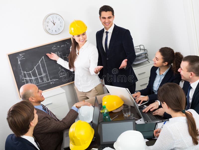 Group of Engineers Discussing Project Stock Photo - Image of builders ...