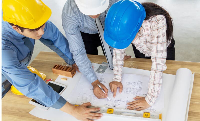 A Group of Engineers are Looking at a Blueprint for Construction Stock ...