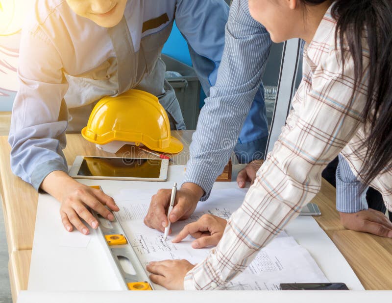 A Group of Engineers are Looking at a Blueprint for Construction Stock ...