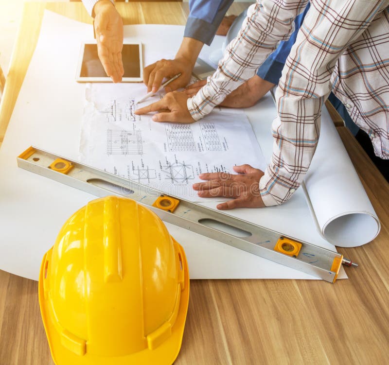 A Group of Engineers are Looking at a Blueprint for Construction Stock ...
