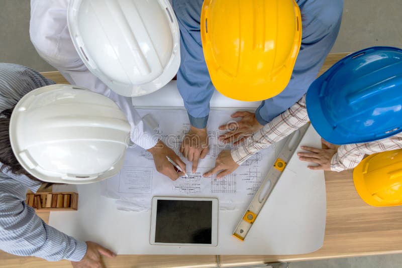 A Group of Engineers are Looking at a Blueprint for Construction Stock ...