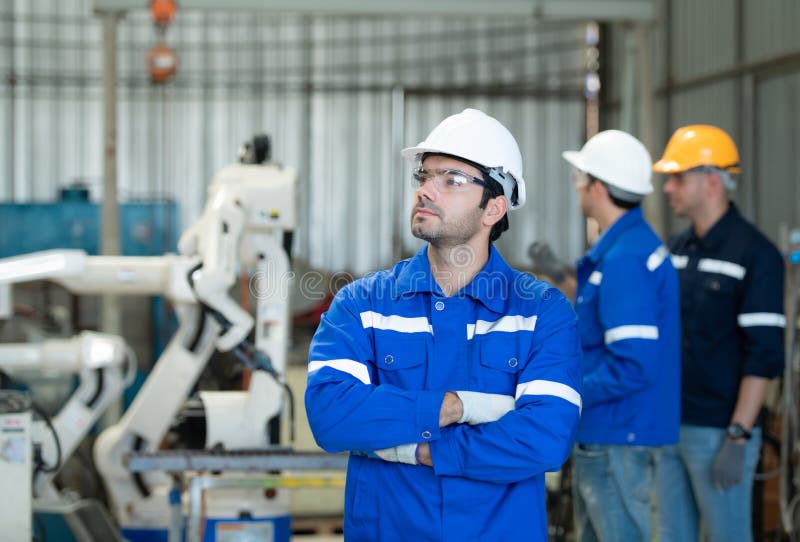 Group of Engineers are Manipulating a Welding Robot Hand. by Combining ...