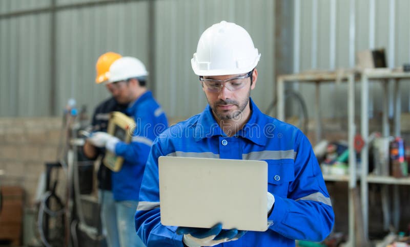 Group of Engineers are Manipulating a Welding Robot Hand. by Combining ...