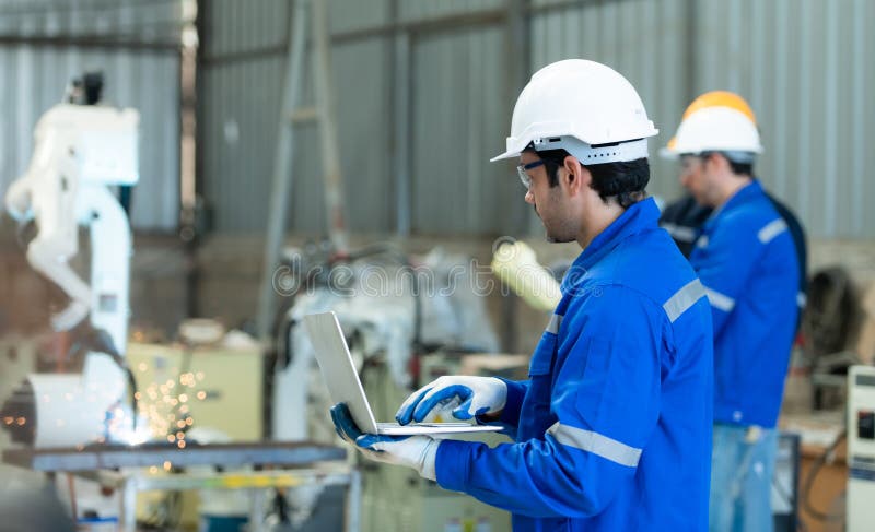 Group of Engineers are Manipulating a Welding Robot Hand. by Combining ...