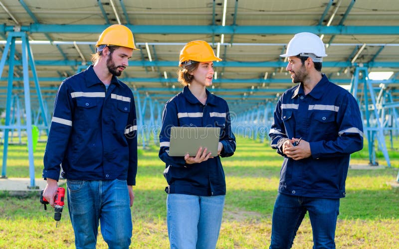 Group of Engineers with Sustainable Energy Installation at Solar Cell ...