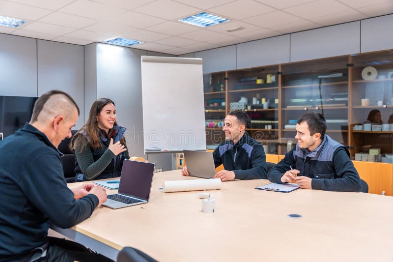 Group of Engineers Talking during a Meeting in a Fabric Stock Image ...