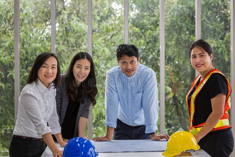 Group Engineers Working Meeting Room at the Office. Team Workers are ...