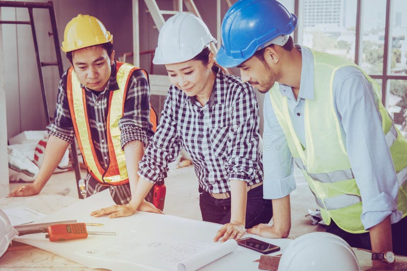 Group of Engineers Working Team Smart Standing Engineer Worker Stock ...