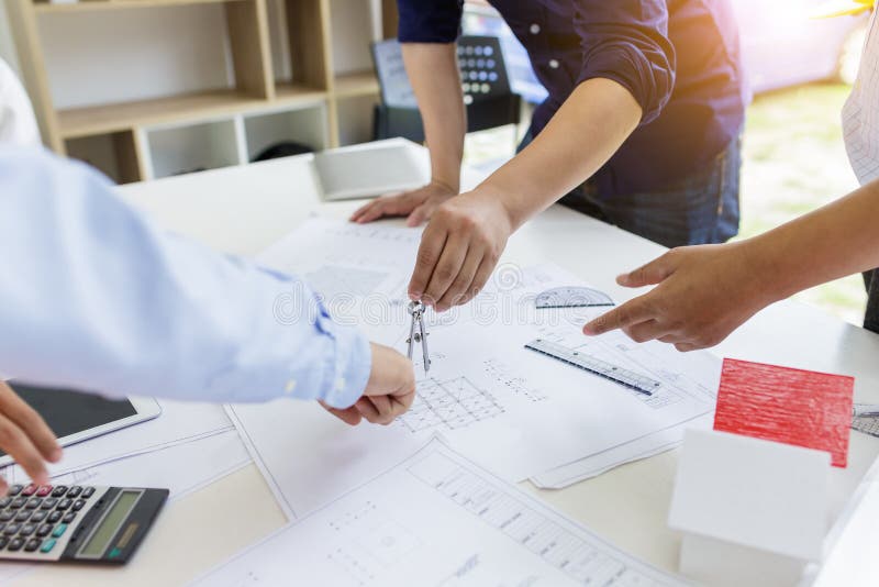 Group of Engineers Working Together To Plan the Project at the Meeting ...