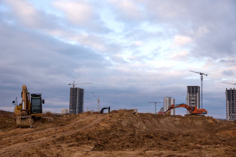 Group of the Excavators for Dig Ground Trenching at a Construction Site ...