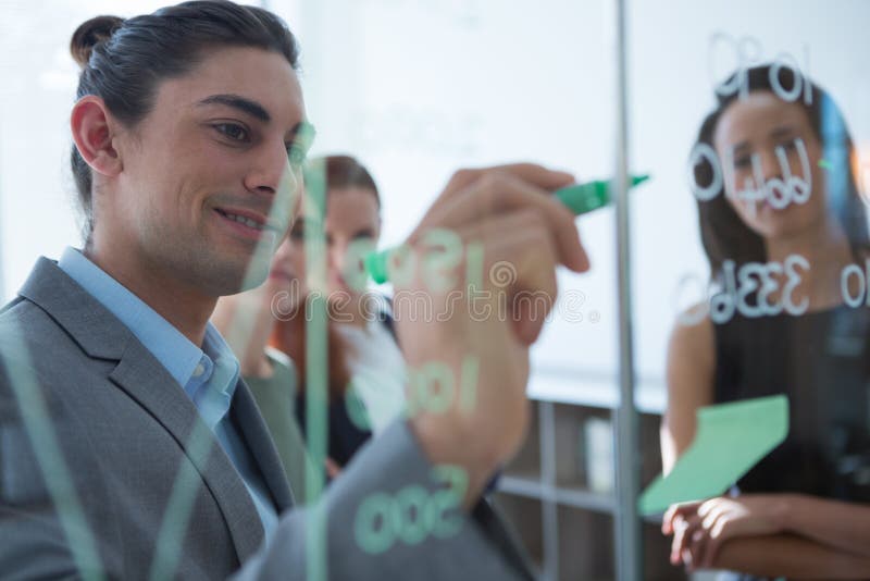 Group of Executives Discussing Over Information on the Wall Stock Photo ...