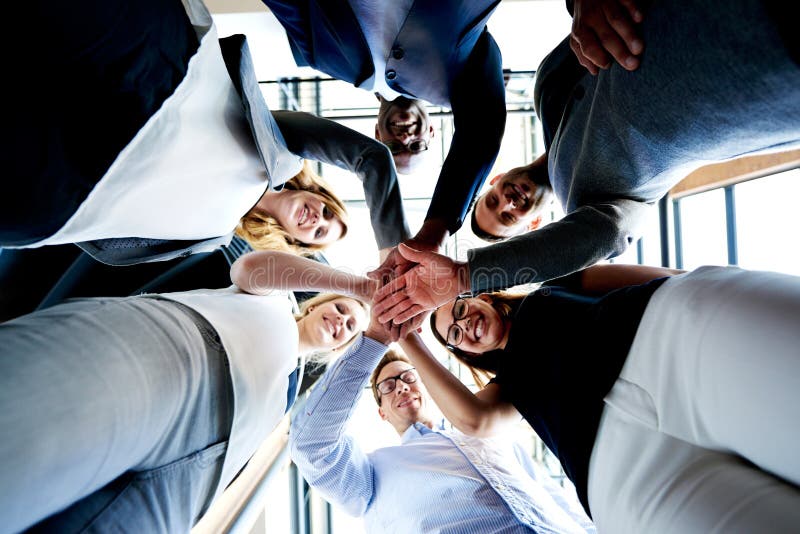 Group of Executives Looking Down Hands Together Stock Image - Image of ...