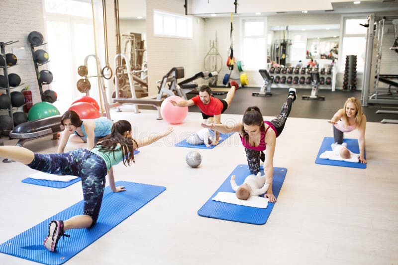 Group Exercise Class, Mother Working Out with Baby in Gym. Moms Staying ...