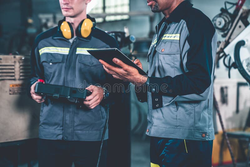 Group of Factory Job Workers Using Adept Machine Equipment in a ...