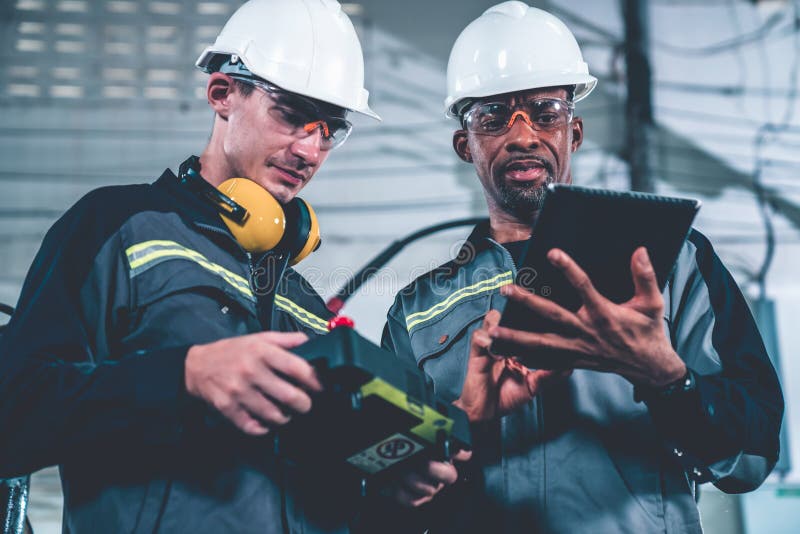 Group of Factory Job Workers Using Adept Machine Equipment in a ...