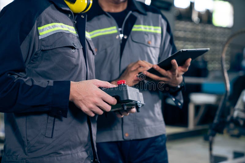 Group of Factory Job Workers Using Adept Machine Equipment in a ...