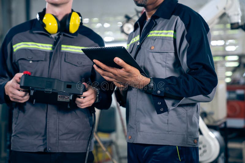 Group of Factory Job Workers Using Adept Machine Equipment in a ...