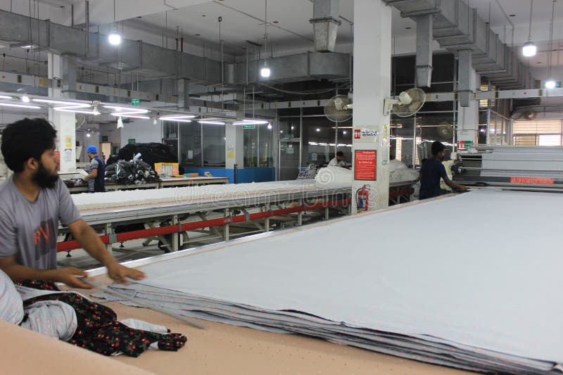 Workers Operating Textile Manufacturing Machines in a Modern Factory ...