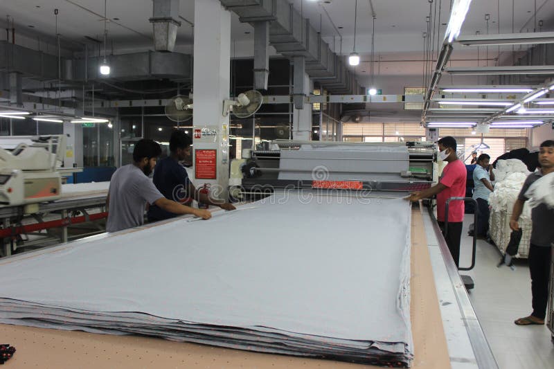 Workers Operating Textile Manufacturing Machines in a Modern Factory ...