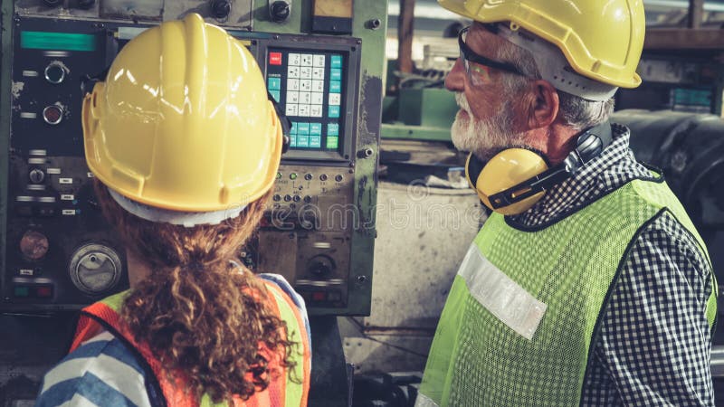 Group of Factory Workers Using Machine Equipment in Factory Workshop ...