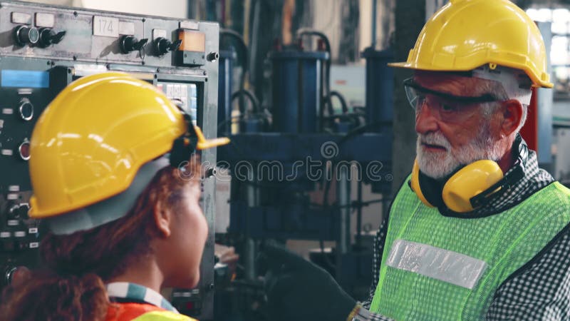 Group of Factory Workers Using Machine Equipment in Factory Workshop ...