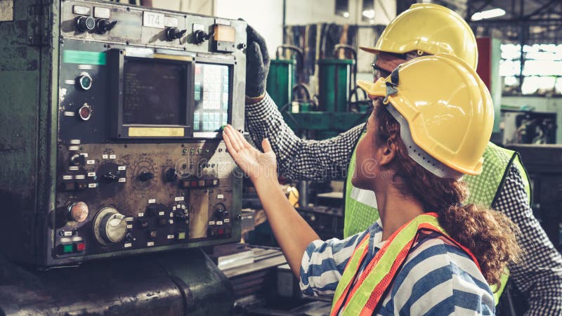 Group of Factory Workers Using Machine Equipment in Factory Workshop ...