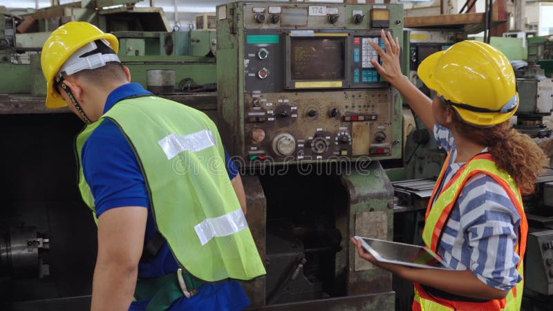 Group of Factory Workers Using Machine Equipment in Factory Workshop ...