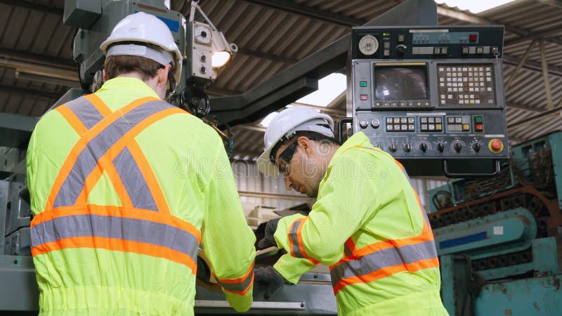 Group of Factory Workers Using Machine Equipment in Factory Workshop ...