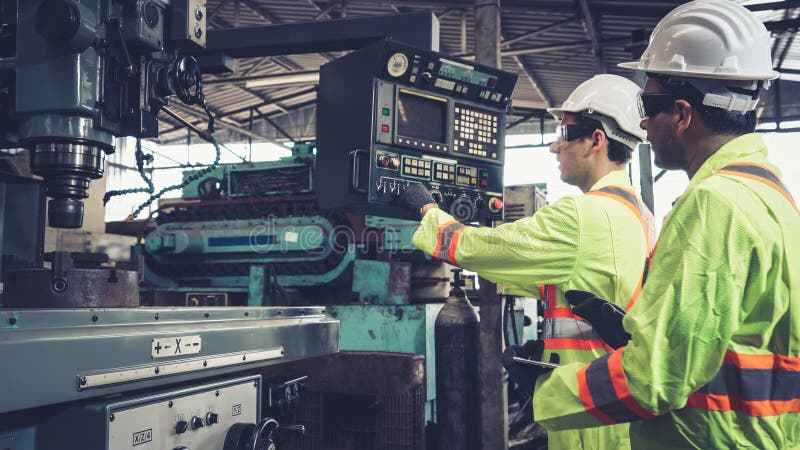 Group of Factory Workers Using Machine Equipment in Factory Workshop ...