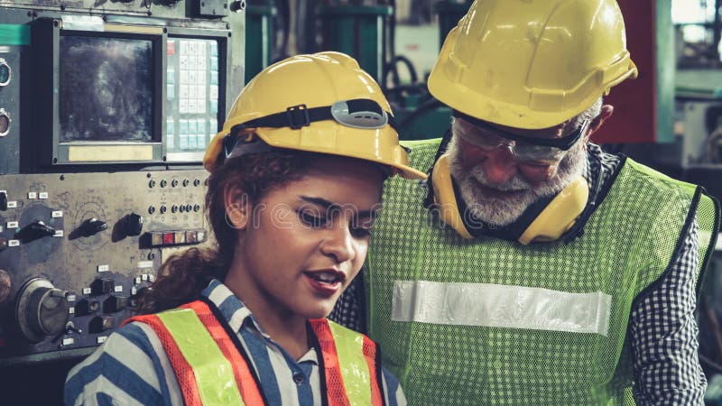 Group of Factory Workers Using Machine Equipment in Factory Workshop ...