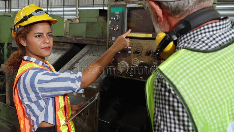 Group of Factory Workers Using Machine Equipment in Factory Workshop ...