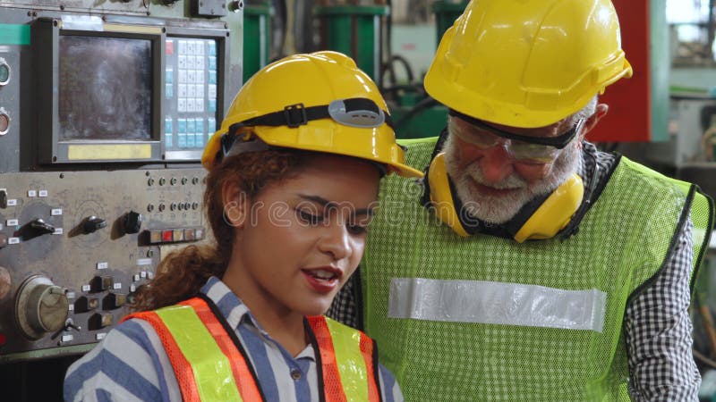 Group of Factory Workers Using Machine Equipment in Factory Workshop ...