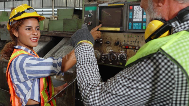 Group of Factory Workers Using Machine Equipment in Factory Workshop ...