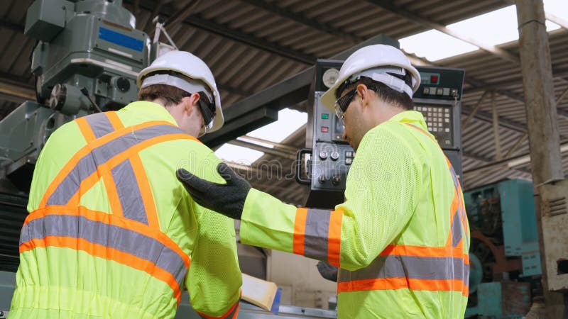 Group of Factory Workers Using Machine Equipment in Factory Workshop ...
