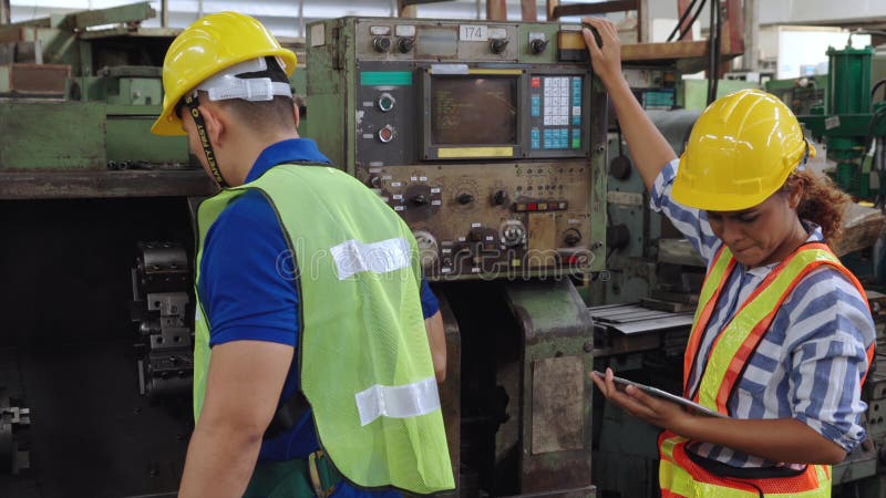 Group of Factory Workers Using Machine Equipment in Factory Workshop ...