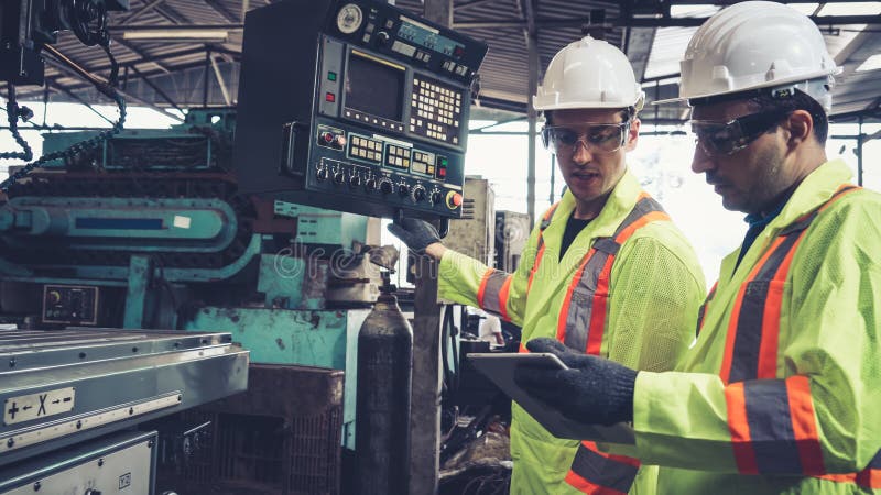 Group of Factory Workers Using Machine Equipment in Factory Workshop ...