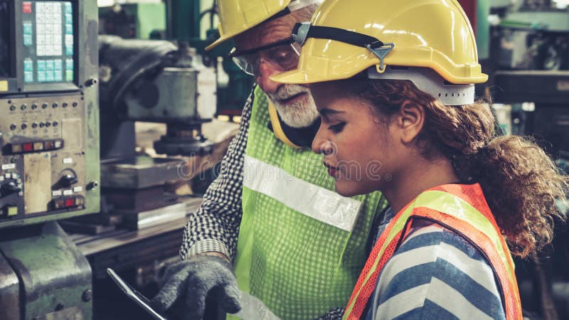 Group of Factory Workers Using Machine Equipment in Factory Workshop ...