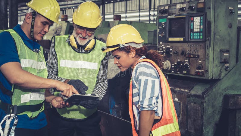 Group of Factory Workers Using Machine Equipment in Factory Workshop ...