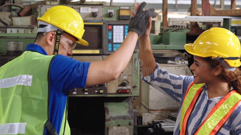 Group of Factory Workers Using Machine Equipment in Factory Workshop ...