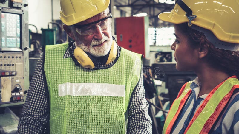 Group of Factory Workers Using Machine Equipment in Factory Workshop ...