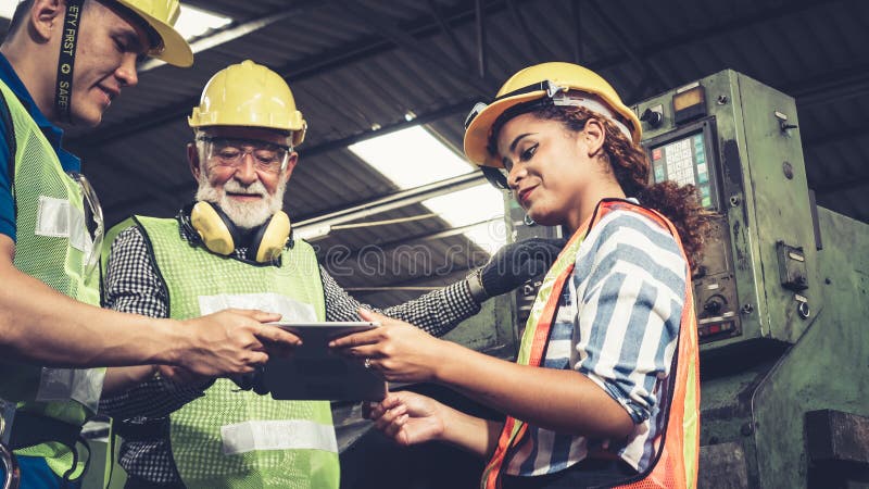 Group of Factory Workers Using Machine Equipment in Factory Workshop ...
