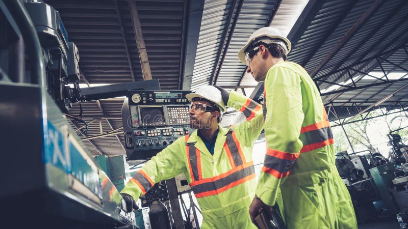 Group of Factory Workers Using Machine Equipment in Factory Workshop ...