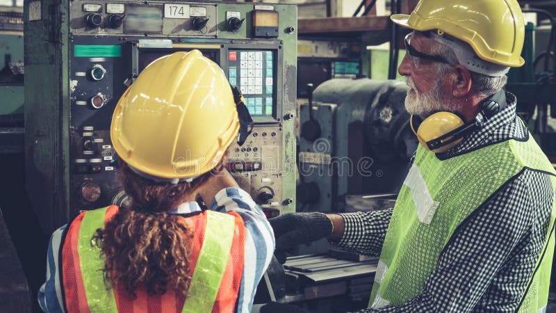Group of Factory Workers Using Machine Equipment in Factory Workshop ...