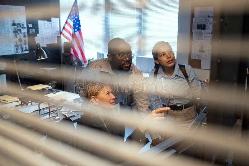 Group of FBI Agents Watching Record from Security Camera Inside Office ...