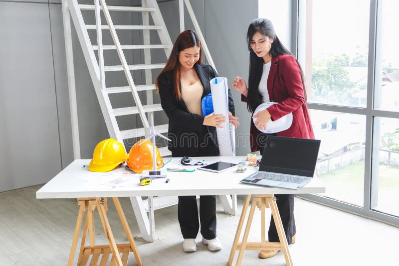 Group of Female Engineer and Architecture Working Together at Project ...